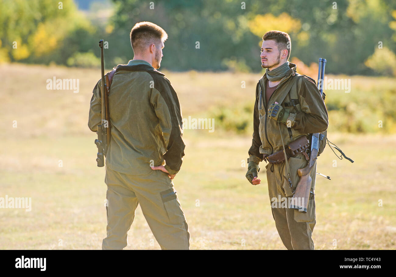 Man hunters with rifle gun. Boot camp. Friendship of men hunters. Army ...