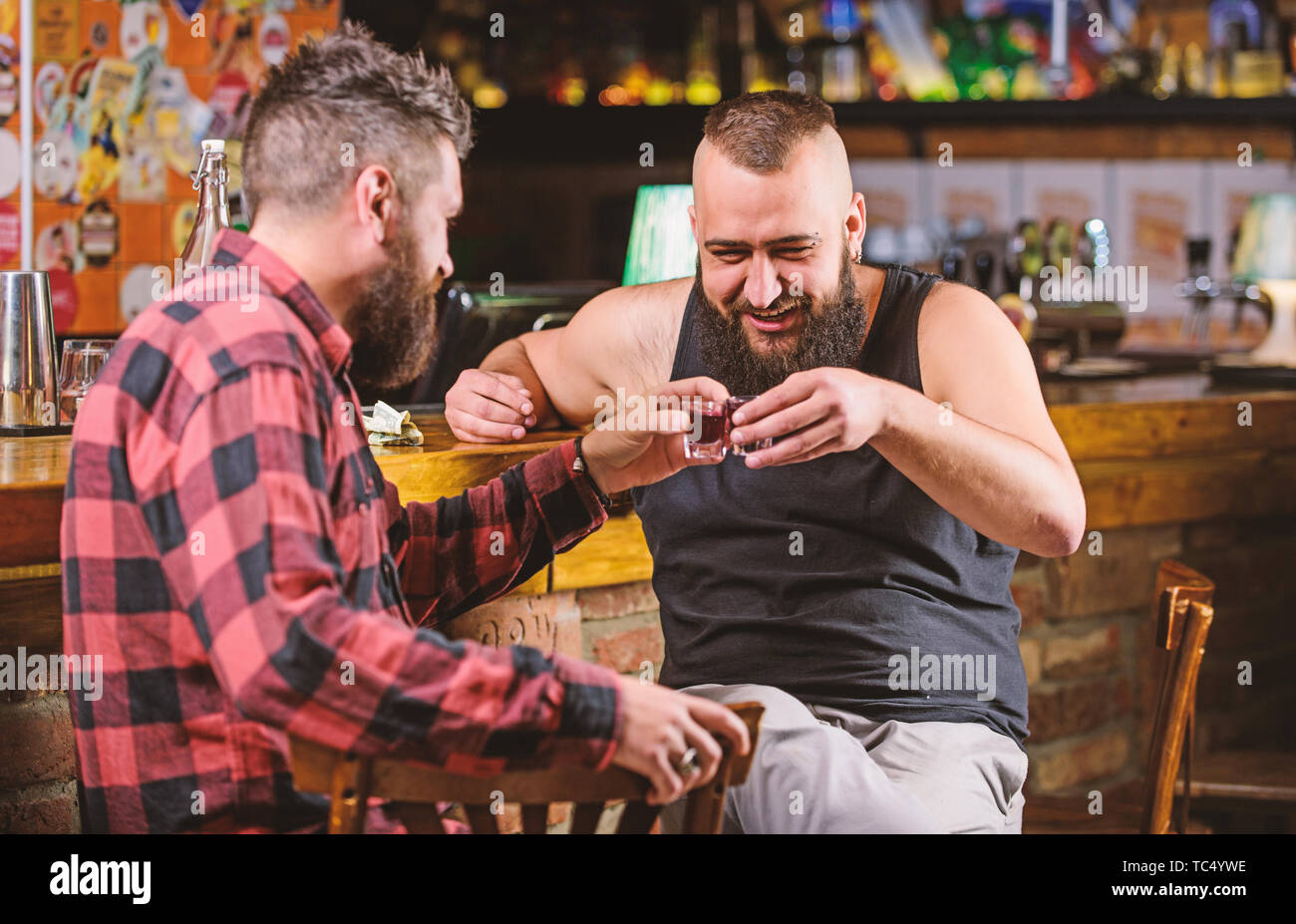 Drunk conversation. Cheers concept. Hipster brutal bearded man drinking ...