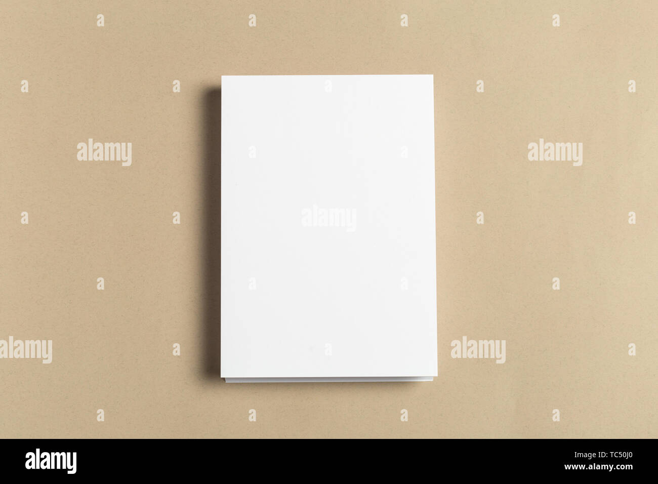 White business card on wooden table. Blank portrait A4 Stock Photo - Alamy