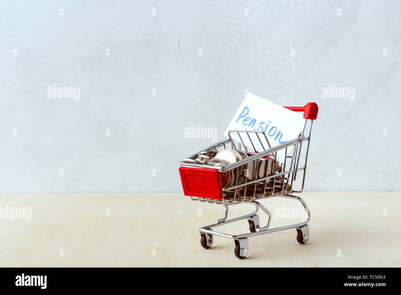 Saving Money Concept. Shopping trolley or cart with coin Stock Photo ...