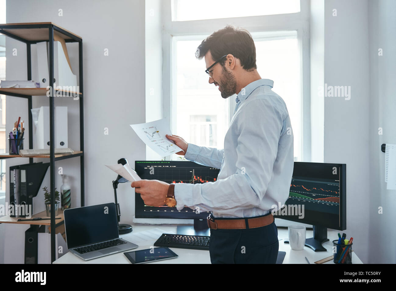 business, internet and technology concept - smiling woman looking at ...