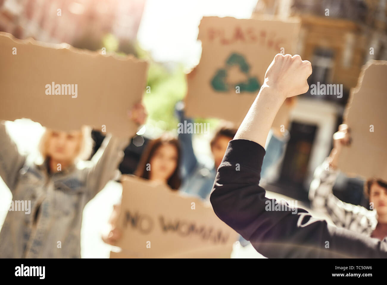 Fight like a girl Back view of female activist protesting for ecology ...