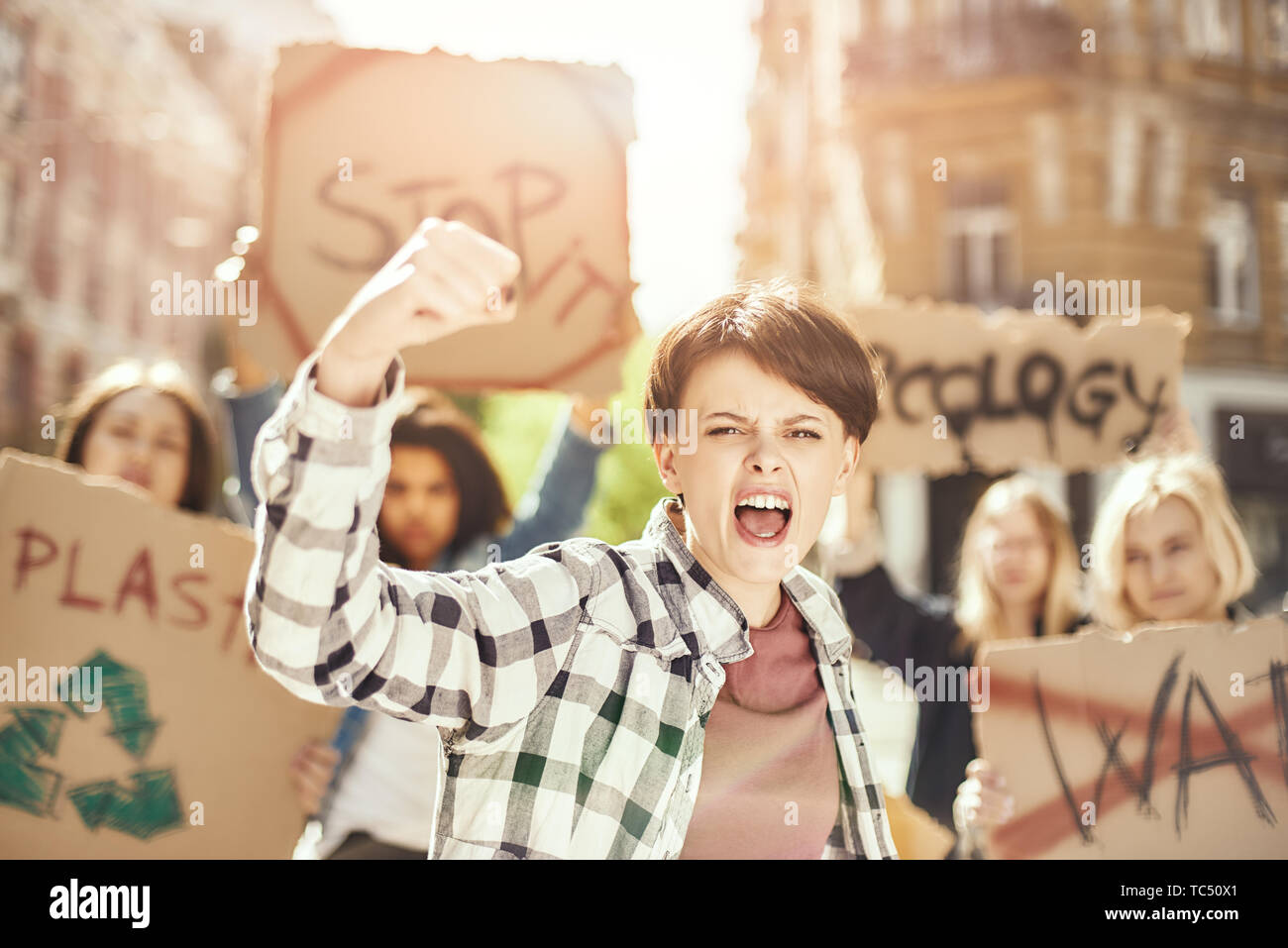 Fighting for clean earth. Young and strong woman is protesting for ...