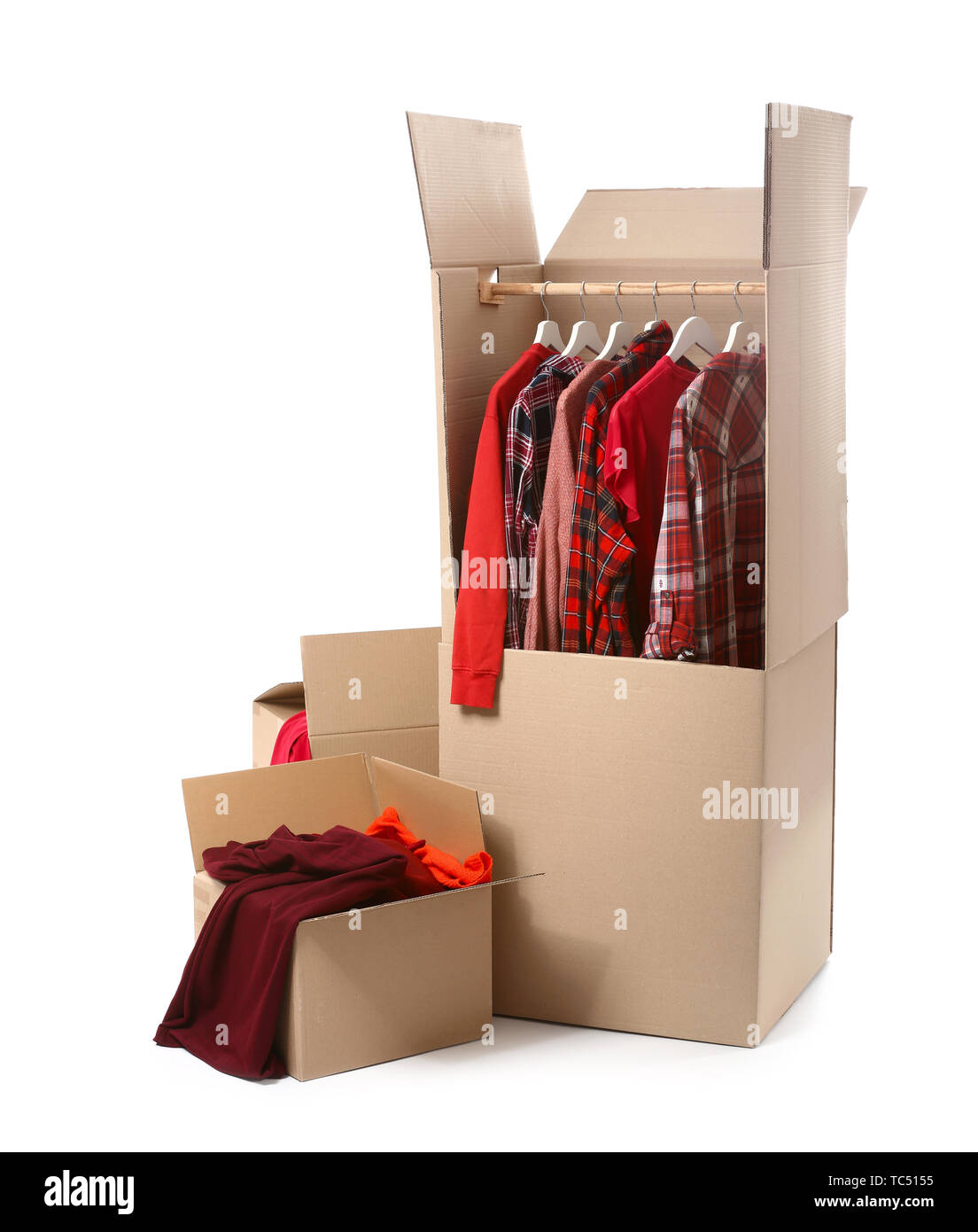 Wardrobe boxes with clothes on white background Stock Photo - Alamy