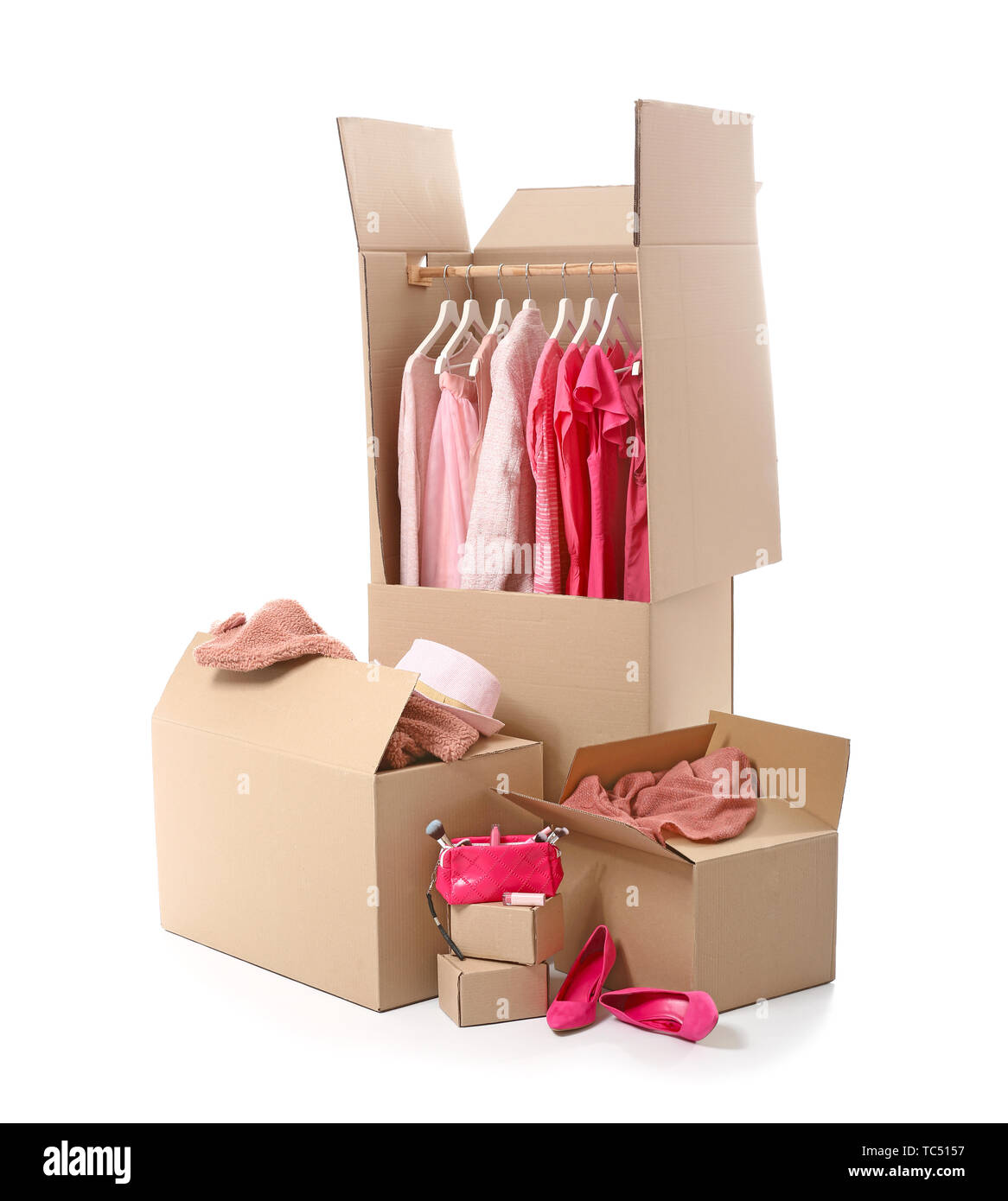 Wardrobe boxes with clothes on white background Stock Photo - Alamy