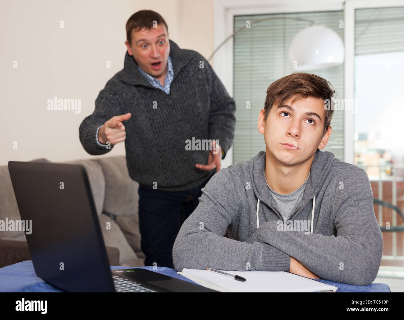 Father unhappy with how teenage son learns Stock Photo - Alamy