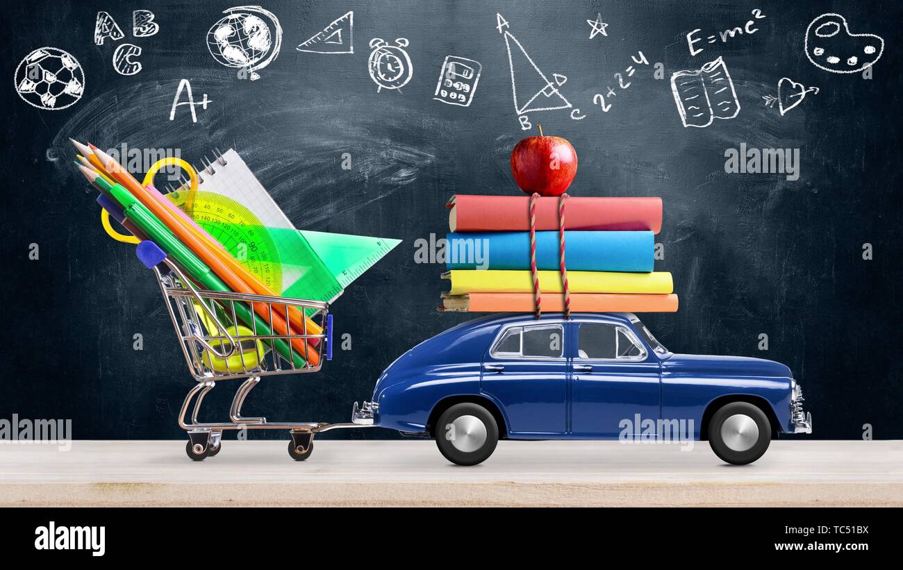 Back to school. Car delivering books and apple against school ...