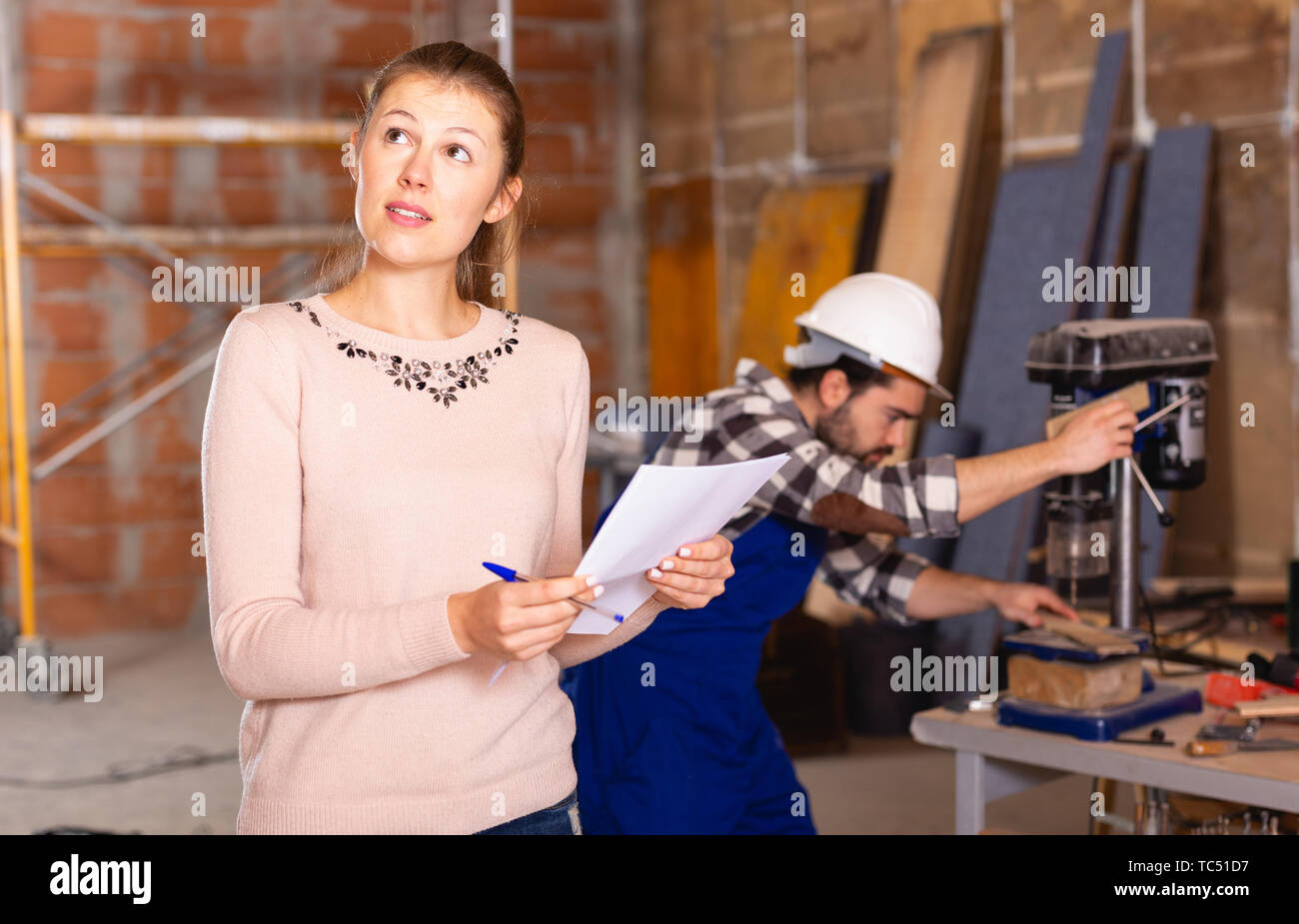 Female designer at construction site Stock Photo - Alamy