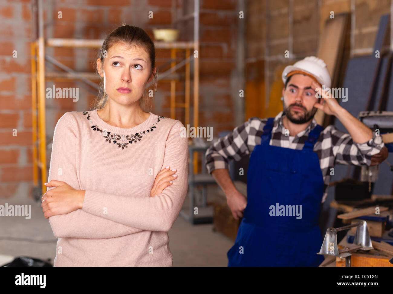 Customer upset with the work of the builder Stock Photo - Alamy