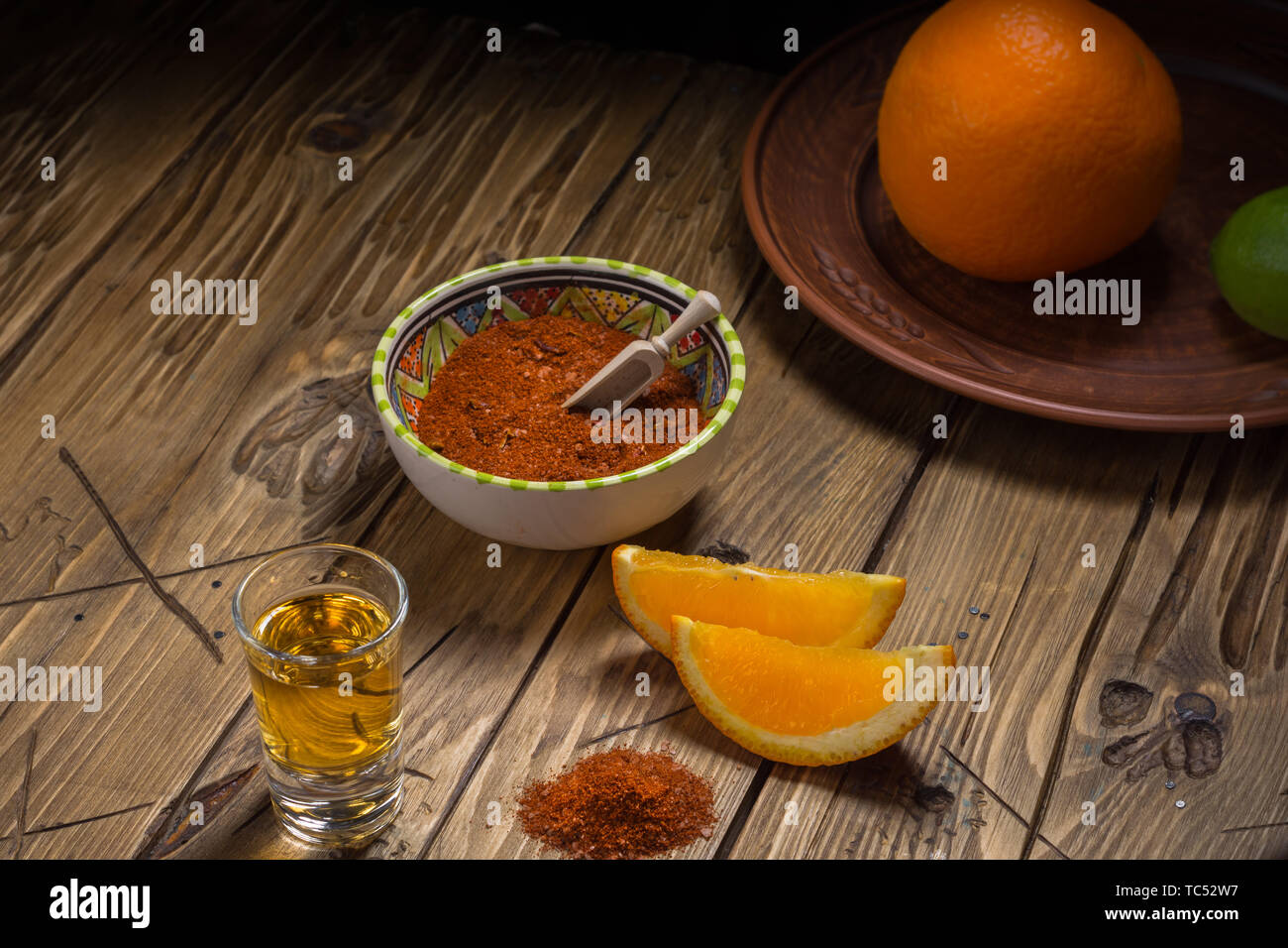 Mezcal - traditional Mexican drink with orange slices and worm salt on ...