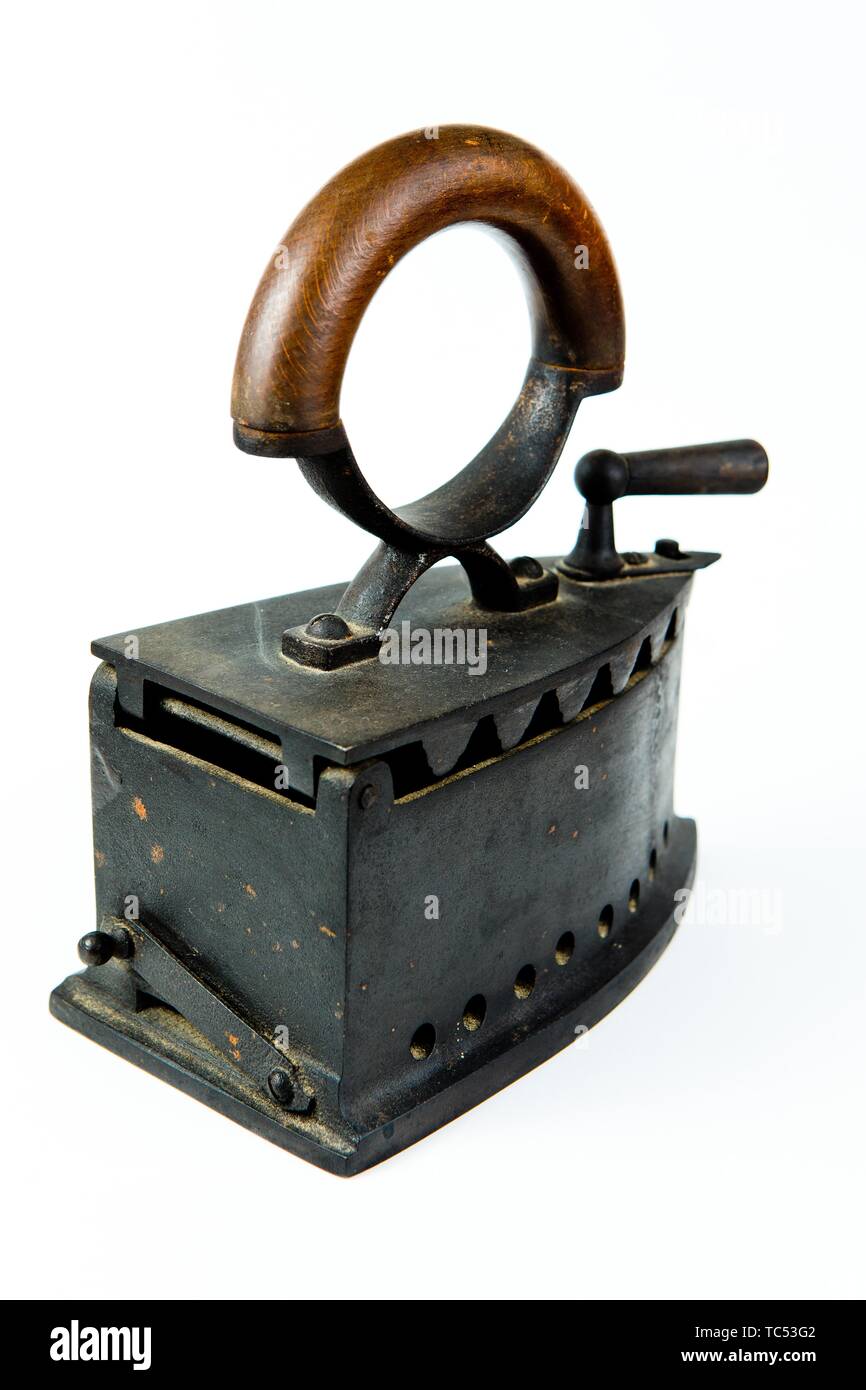 Back view of vintage ironing tool, traditional with wooden handle Stock ...