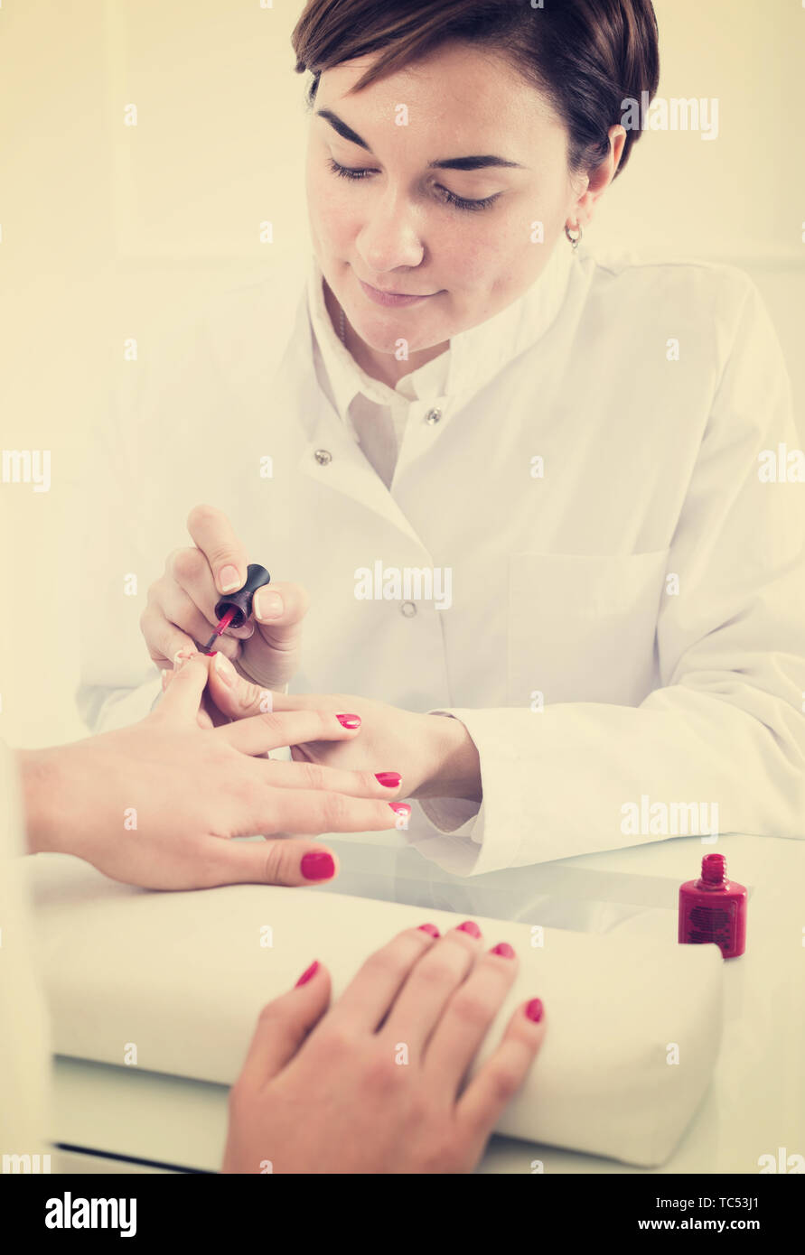 Female client doing nails in nail salon in afternoon Stock Photo - Alamy