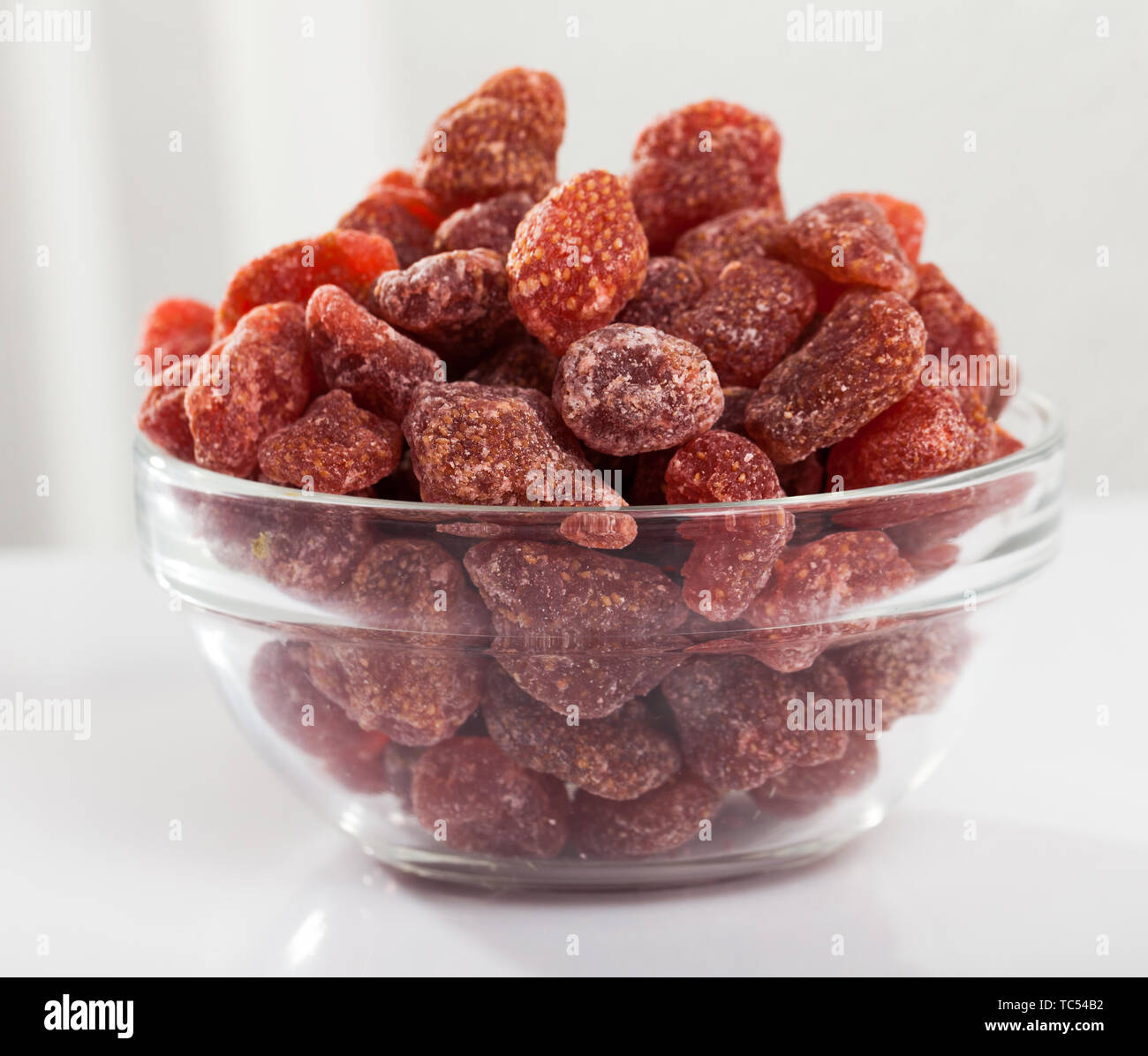 Pile of tasty dehydrated sweet strawberry on white background Stock ...