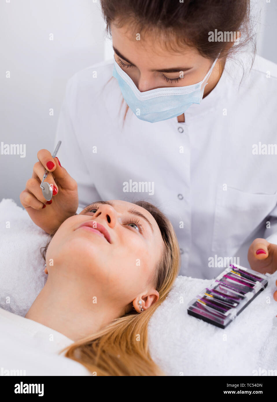 Female doctor doing beauty procedures with young woman client Stock ...