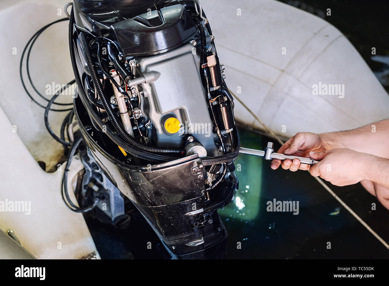 Repairing outboard hi-res stock photography and images - Alamy