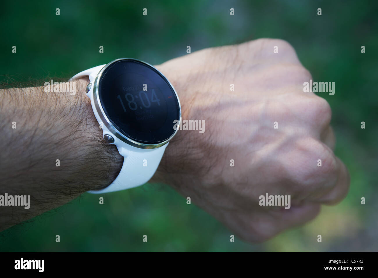 Man checking performance on smartwatch hi-res stock photography and ...