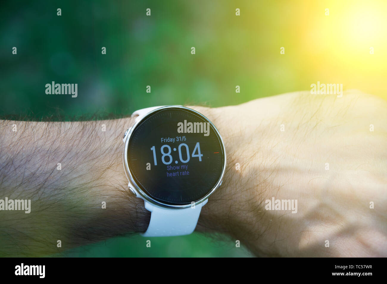 Man checking performance on smartwatch hi-res stock photography and ...