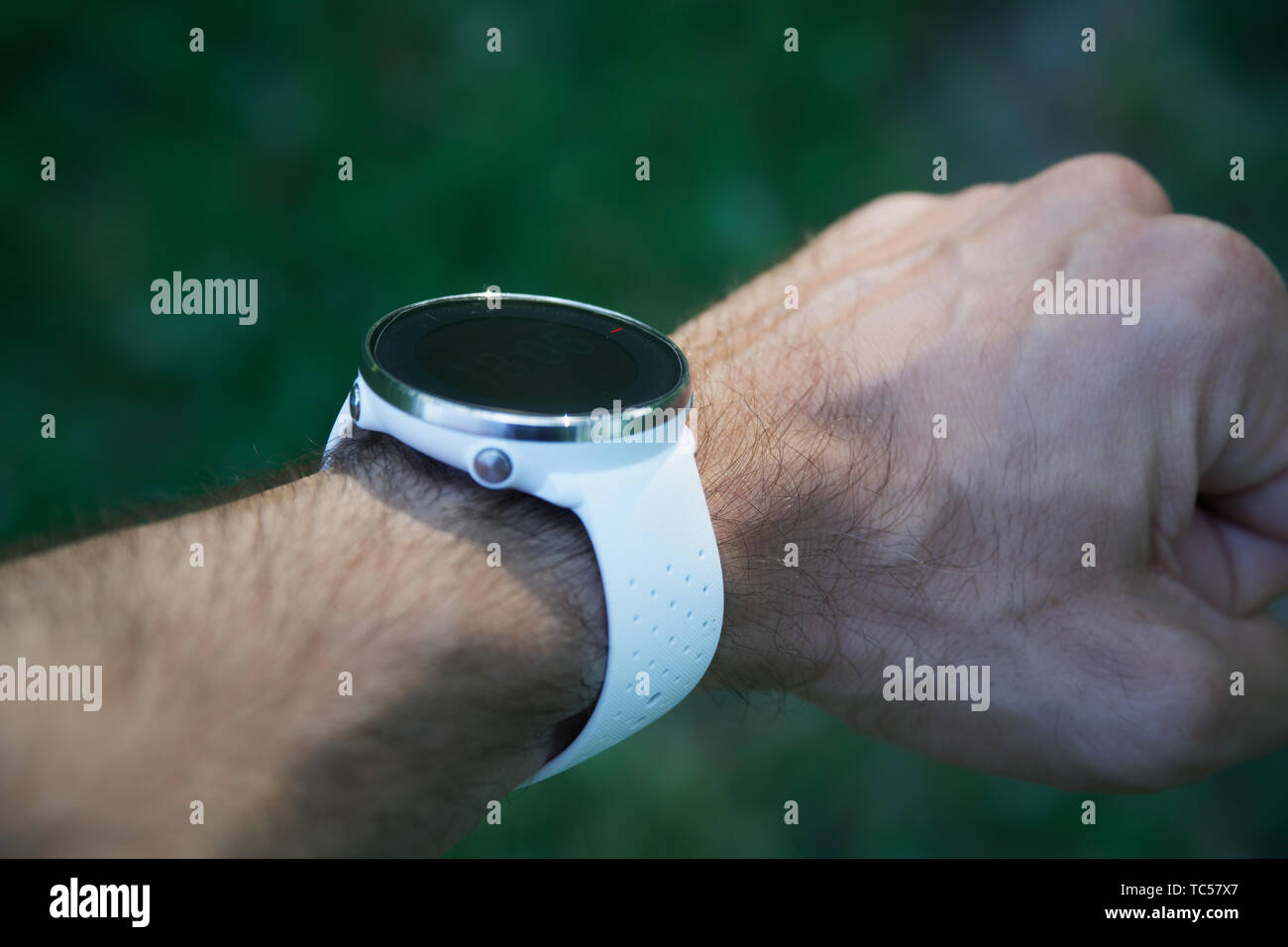 Man checking performance on smartwatch hi-res stock photography and ...