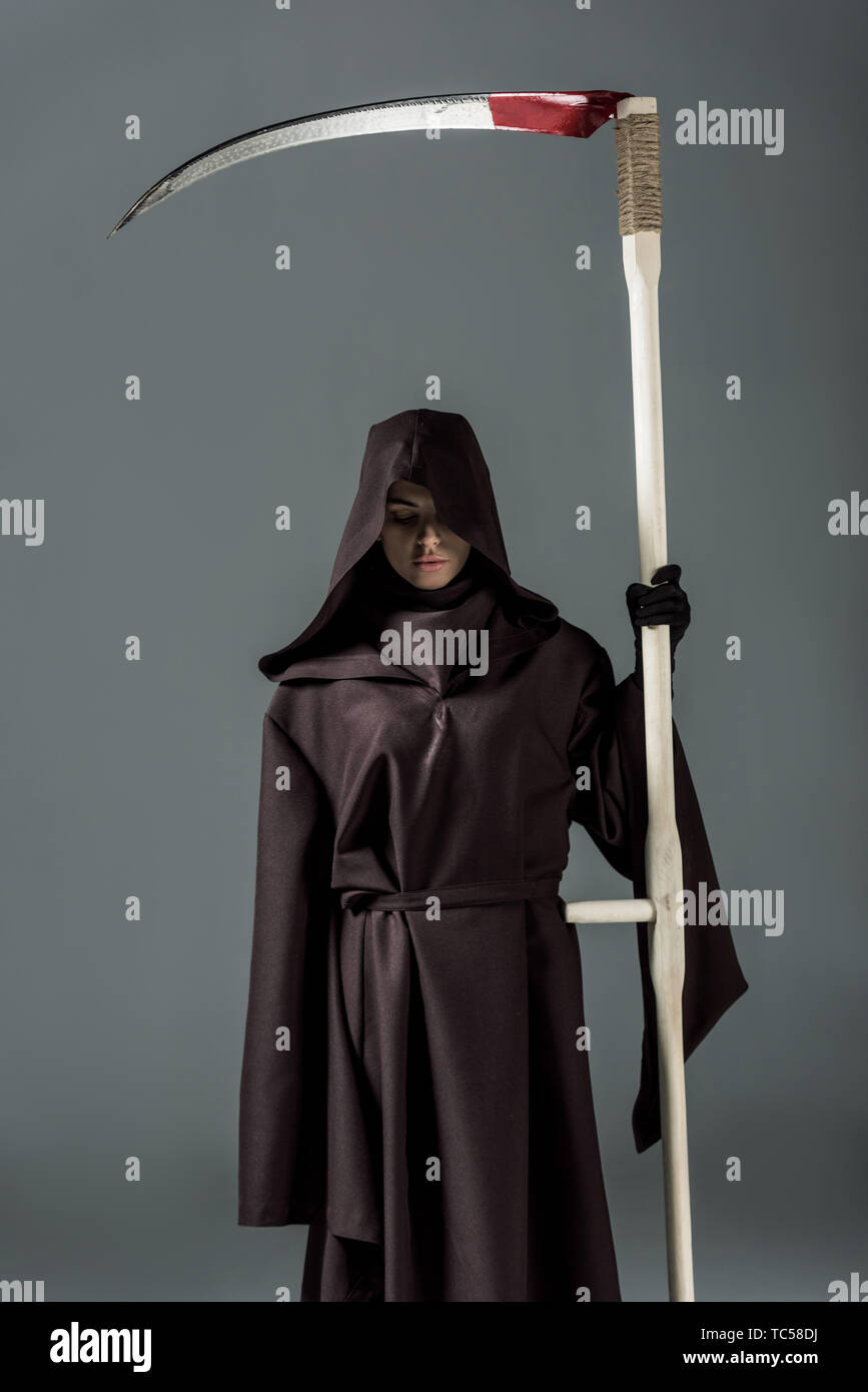 Holding scythe hi-res stock photography and images - Alamy