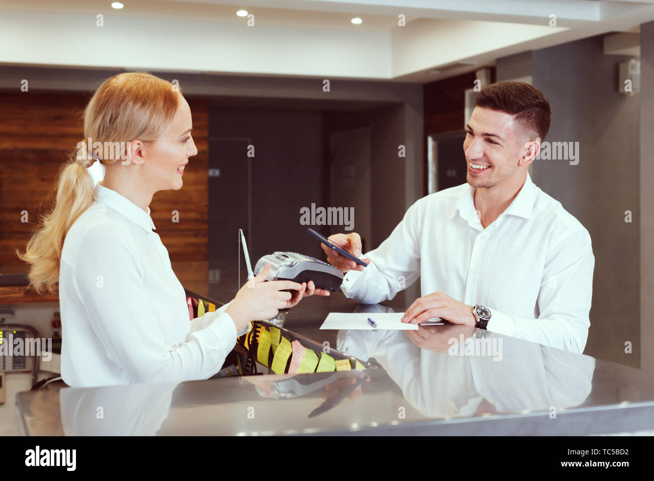 man at hotel reception Stock Photo - Alamy