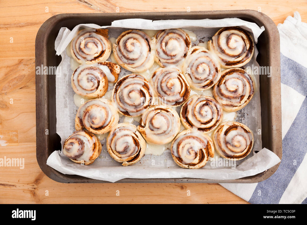 Homemade sweet traditional dessert buns with white cream sauce ...