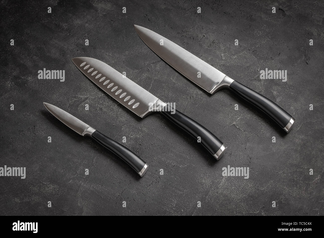 Set of Kitchen Knives on Stone Background Stock Photo - Alamy