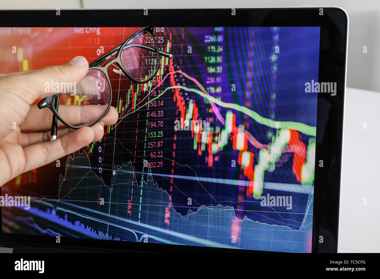 businessman shows the screen on laptop the graph of growth Stock Photo ...
