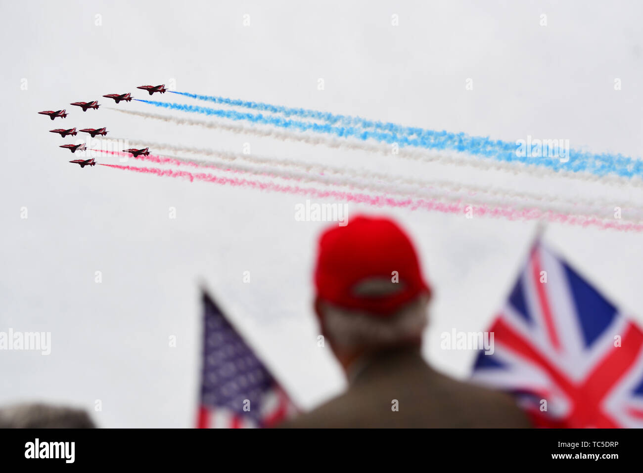 A man watches a Red Arrows display during the commemorations for the ...