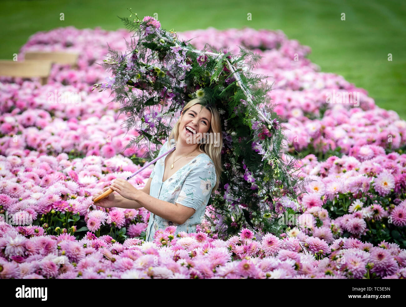 Ellie Mainwaring with a floral parasol made by celebrity florist ...