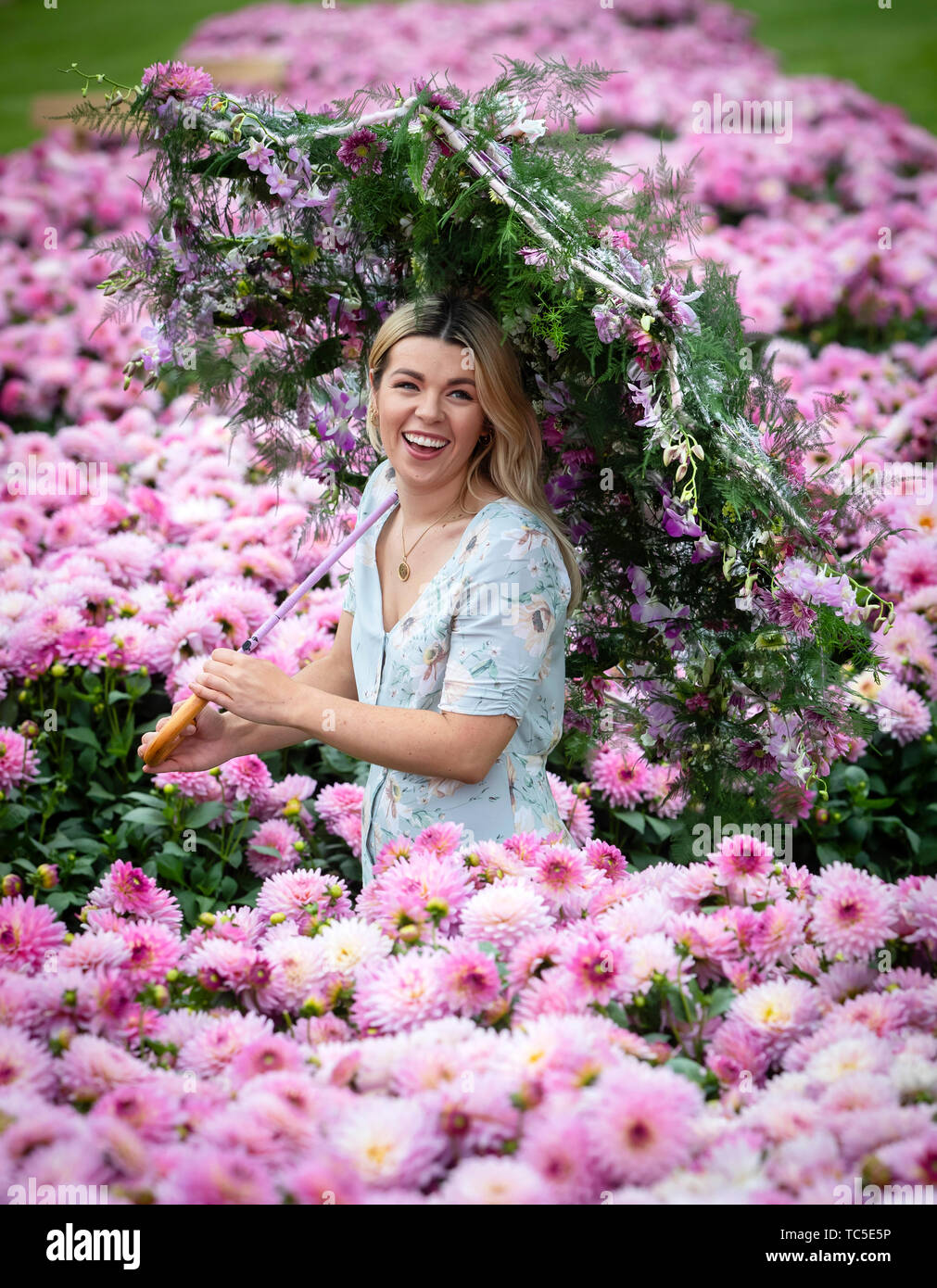 Ellie Mainwaring with a floral parasol made by celebrity florist ...