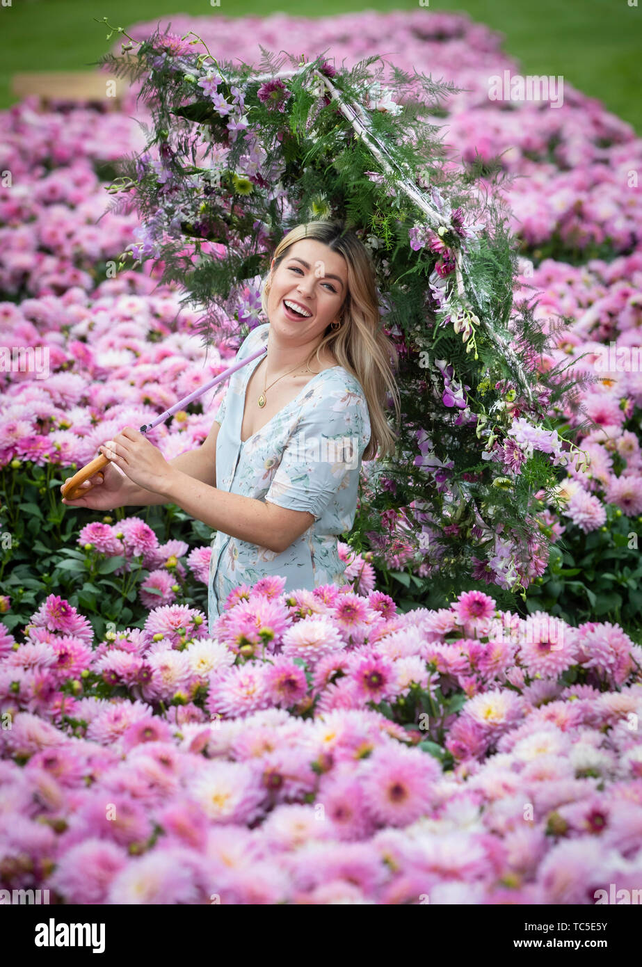 Ellie Mainwaring with a floral parasol made by celebrity florist ...