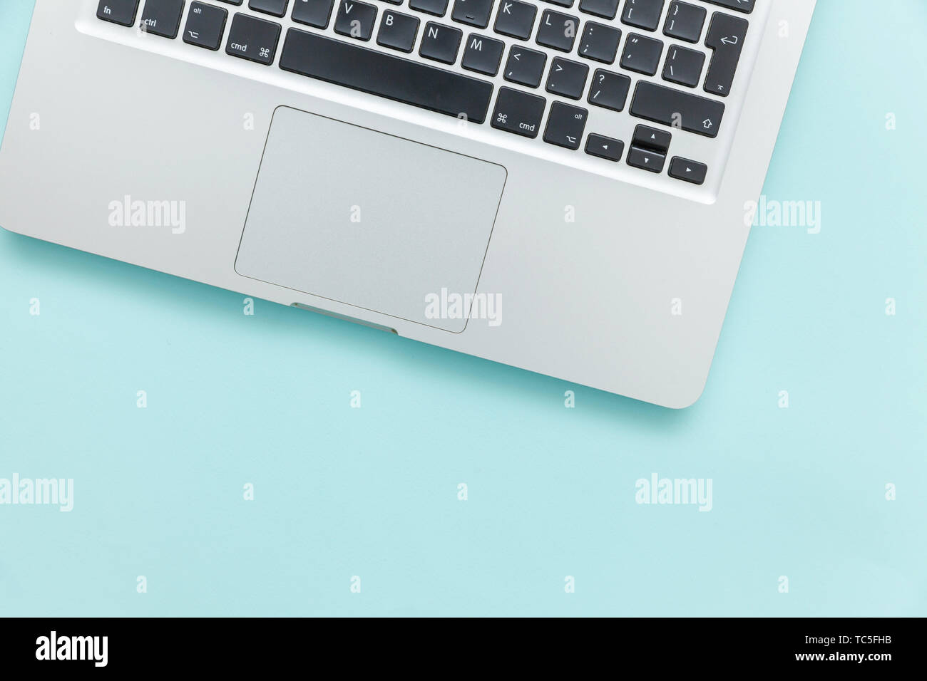 Keyboard laptop computer isolated on blue pastel desk background ...