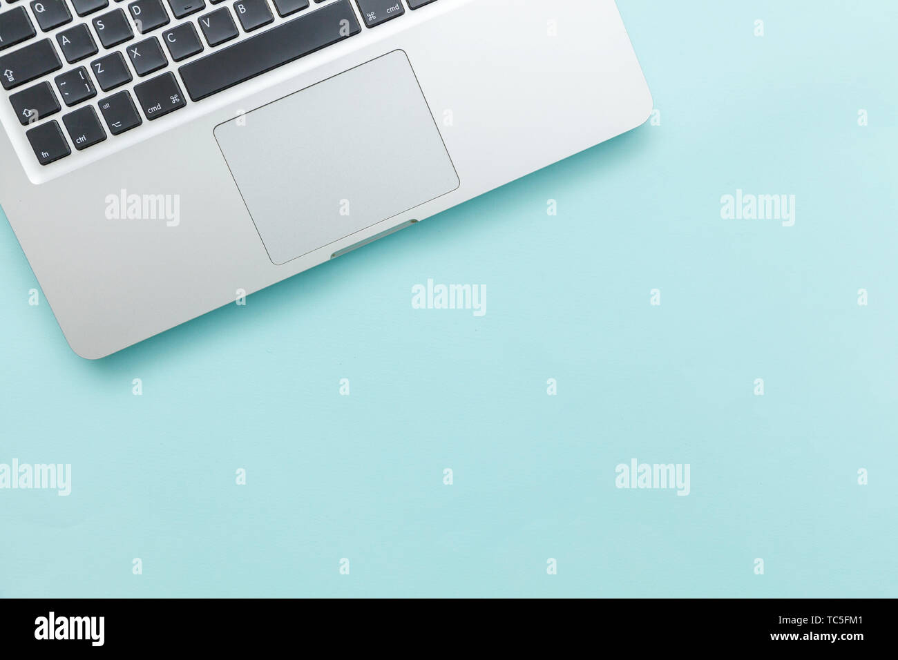 Keyboard laptop computer isolated on blue pastel desk background ...