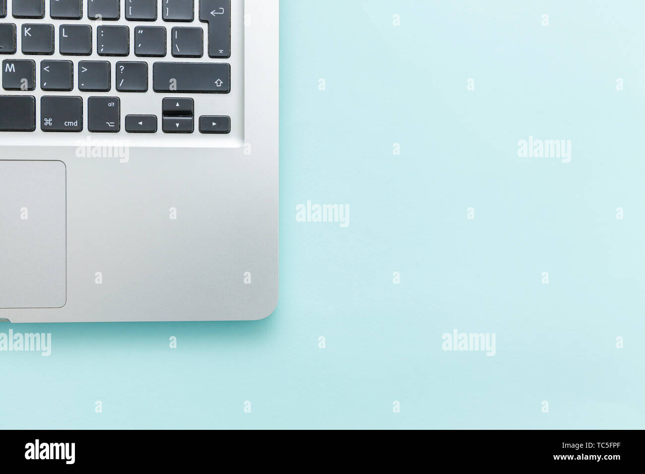 Keyboard laptop computer isolated on blue pastel desk background ...
