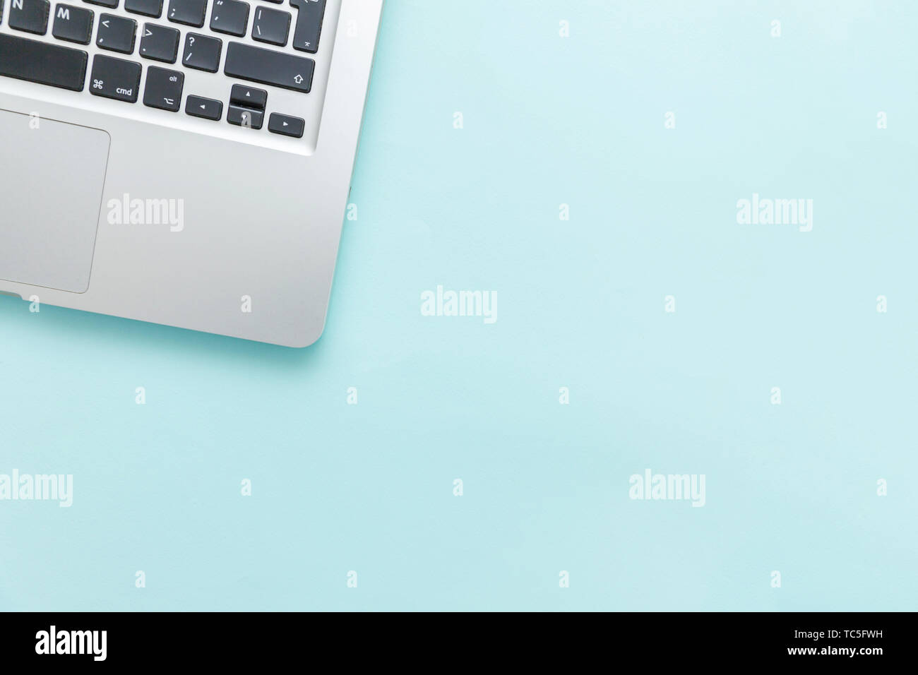 Keyboard laptop computer isolated on blue pastel desk background ...