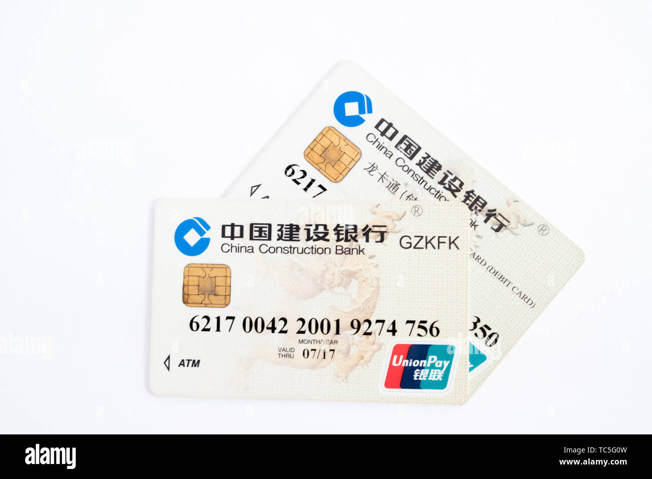 Bank card on solid color background Stock Photo - Alamy