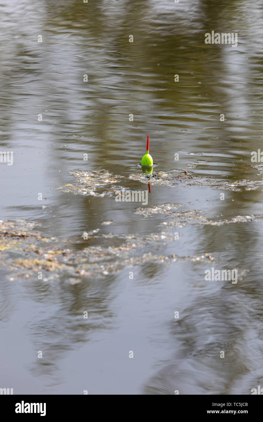 Bobber in water Stock Photo - Alamy