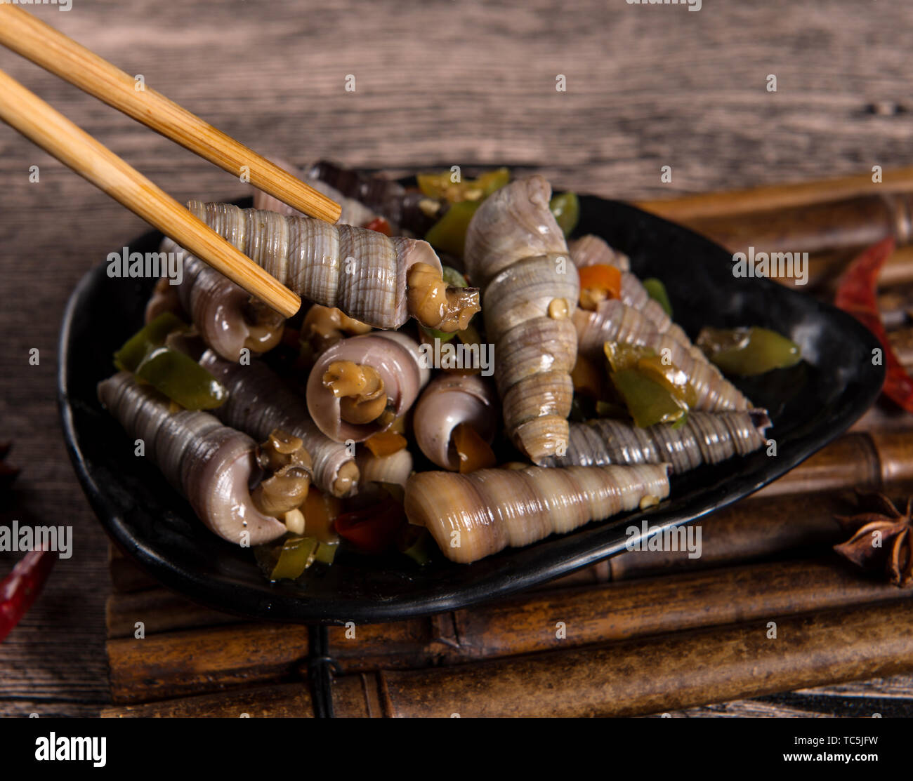 Spicy seafood snail Stock Photo - Alamy