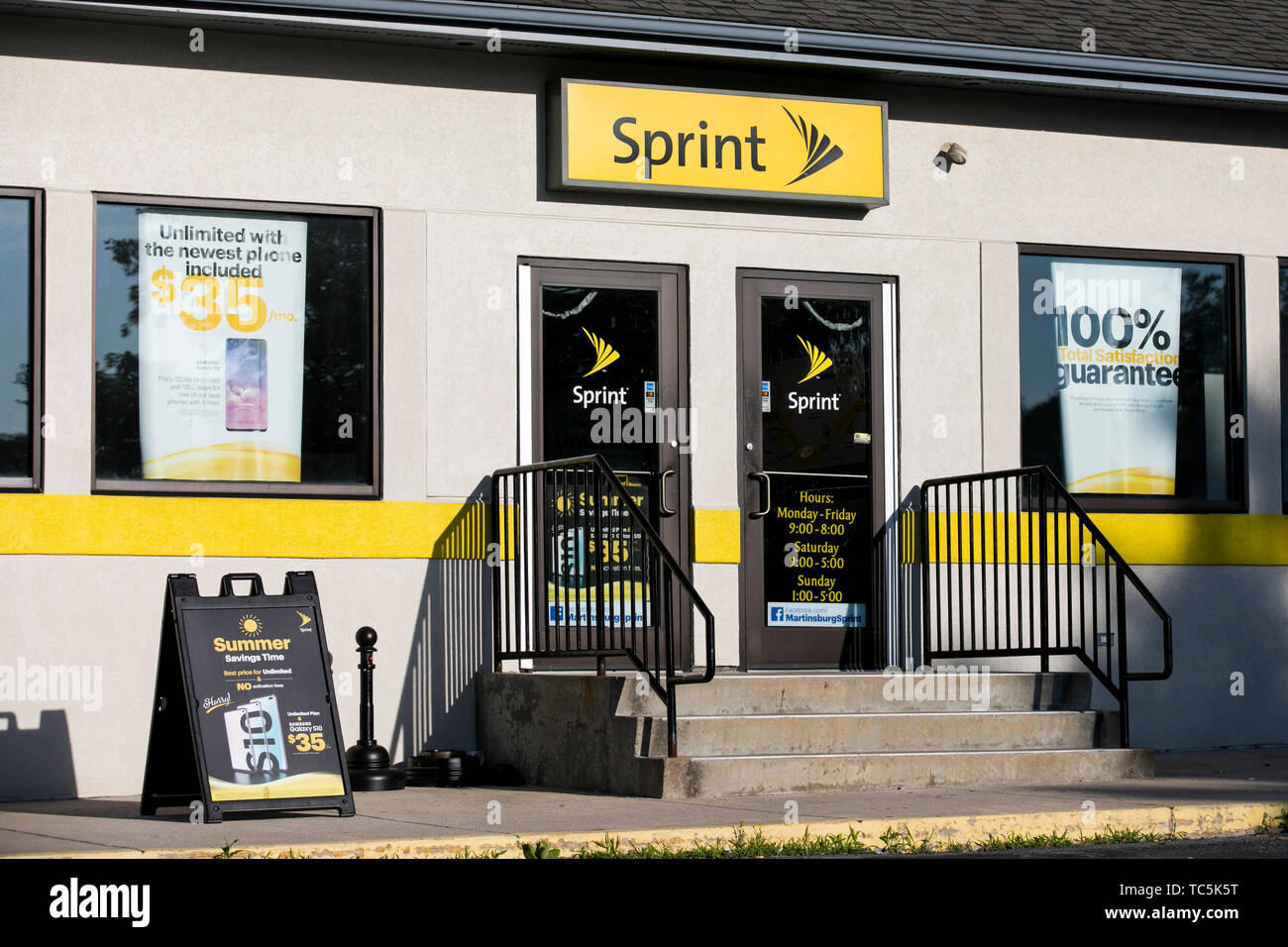 A logo sign outside of a Sprint Corporation retail store location in ...