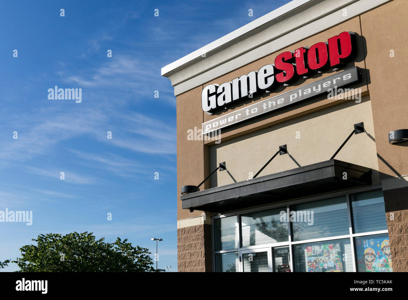 A logo sign outside of a GameStop retail store location in Martinsburg ...