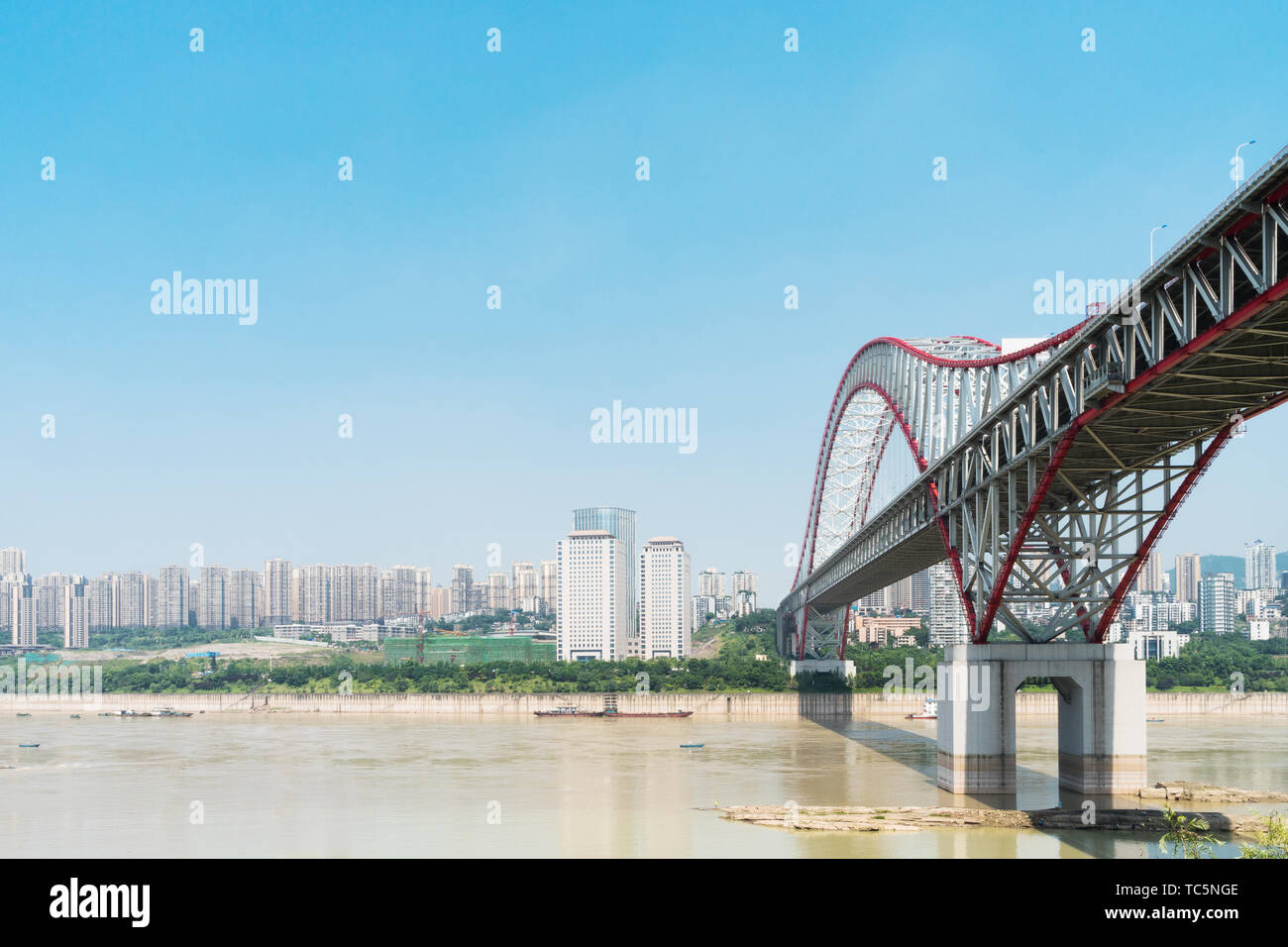 Steel bridge over river in modern city Stock Photo - Alamy