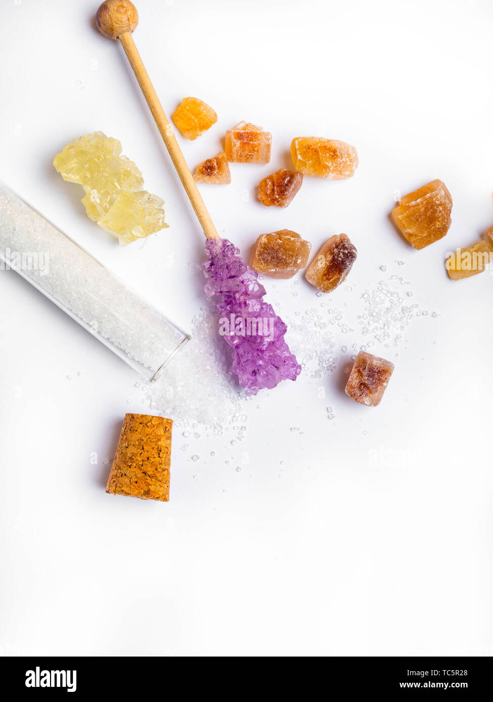 Various different types of sugar, in flask on white background, copy ...