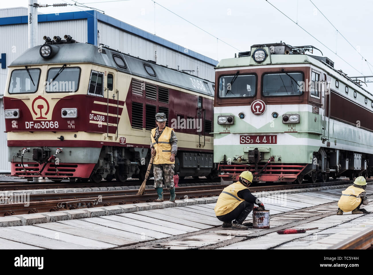 Railway workers maintain high-speed rail tracks in Kunming, southwest ...