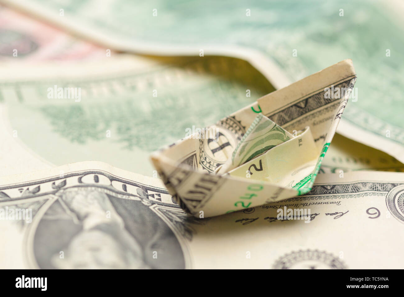 Money banknotes paper boats hi-res stock photography and images - Alamy