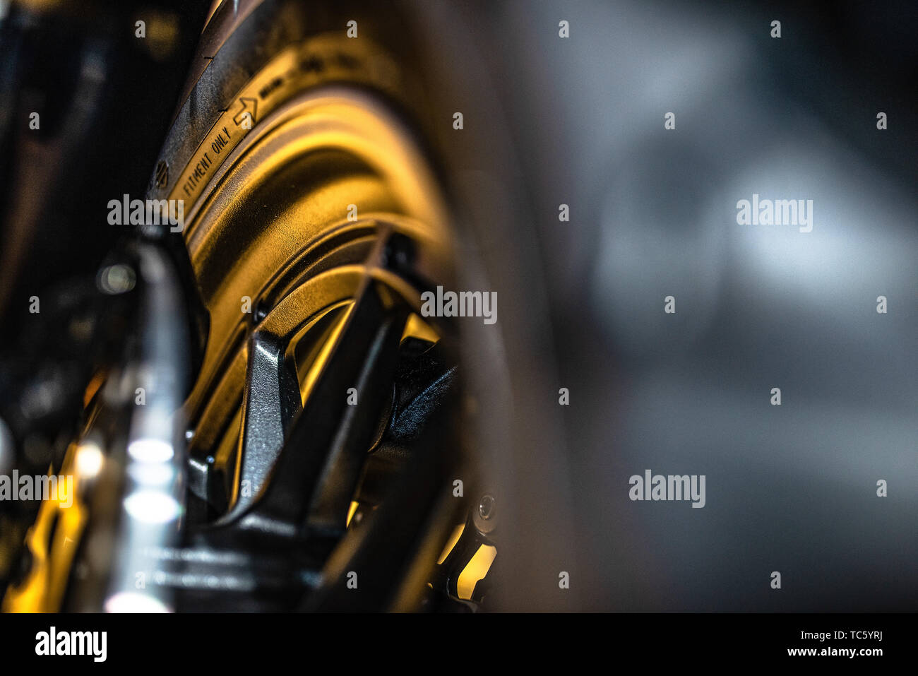 Lights illuminate car tyre details Stock Photo - Alamy