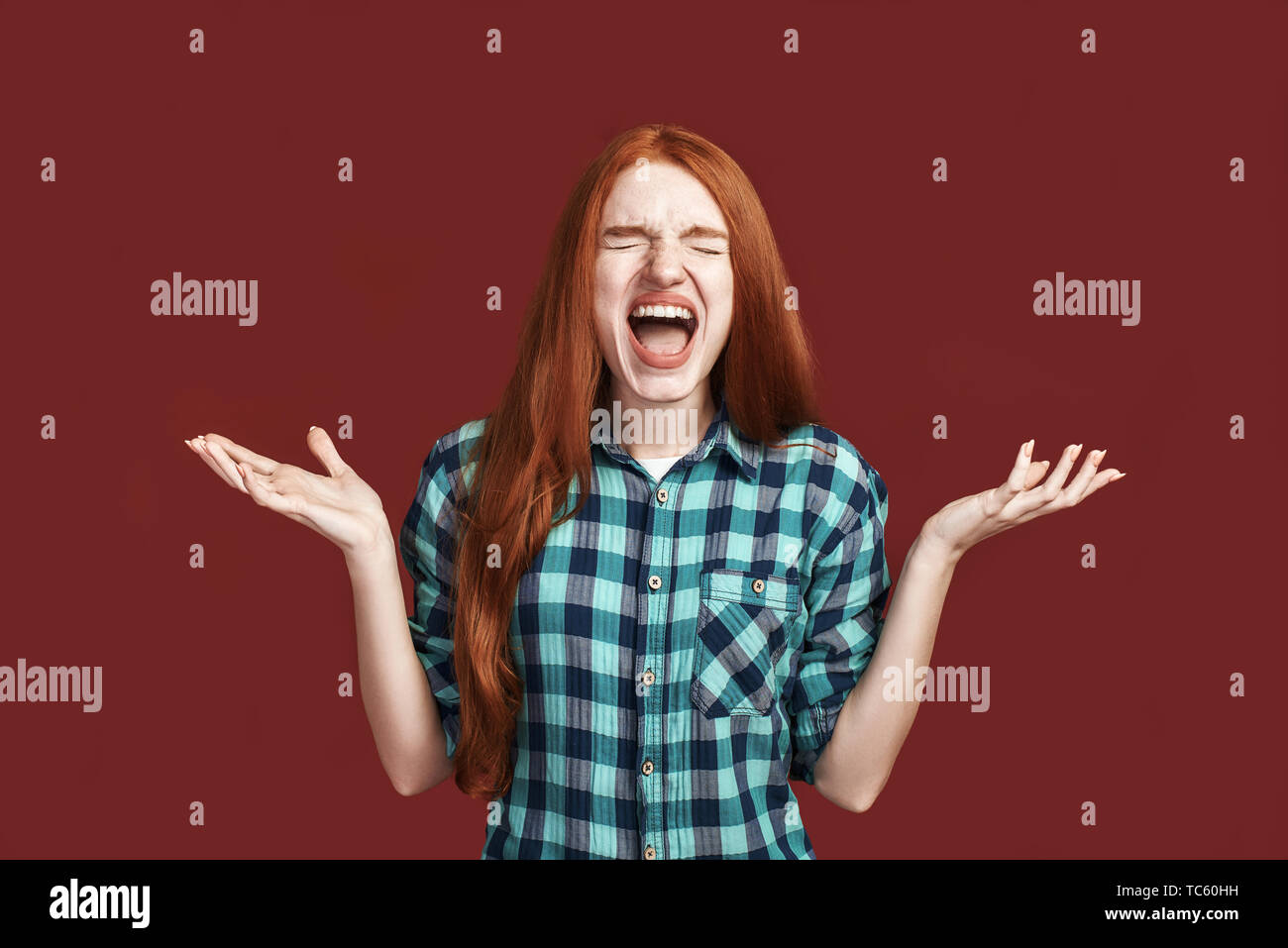 Angry Stressed Hysterical Redhead Woman With Mad Emotional Face