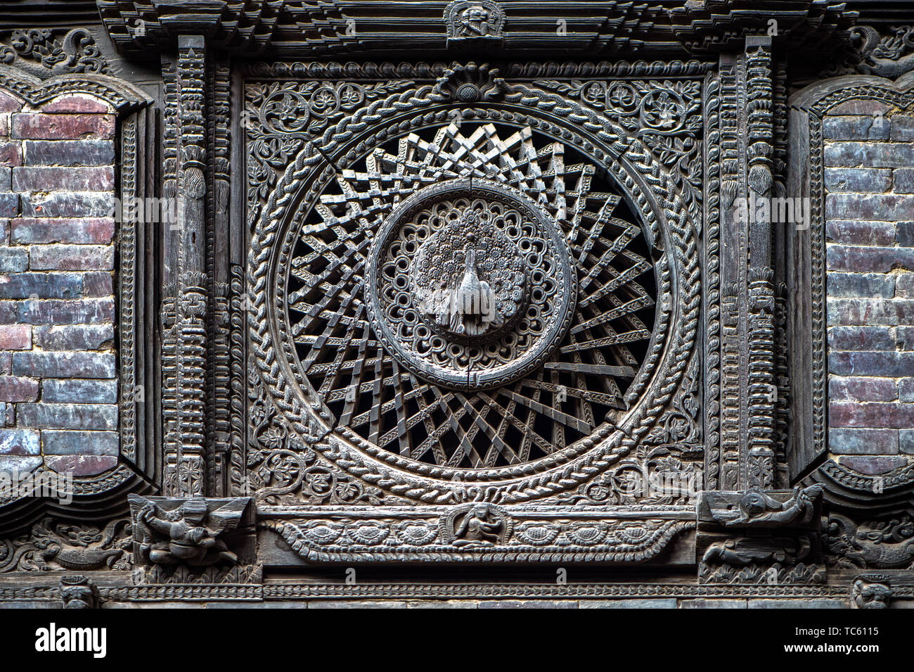 Peacock window in Badgang, Nepal Stock Photo - Alamy
