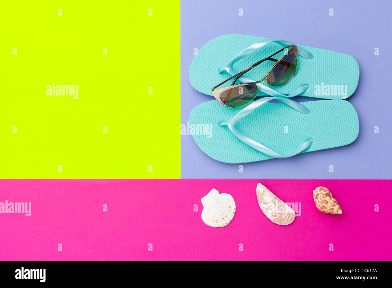 Female flip flops on a color block background Stock Photo - Alamy