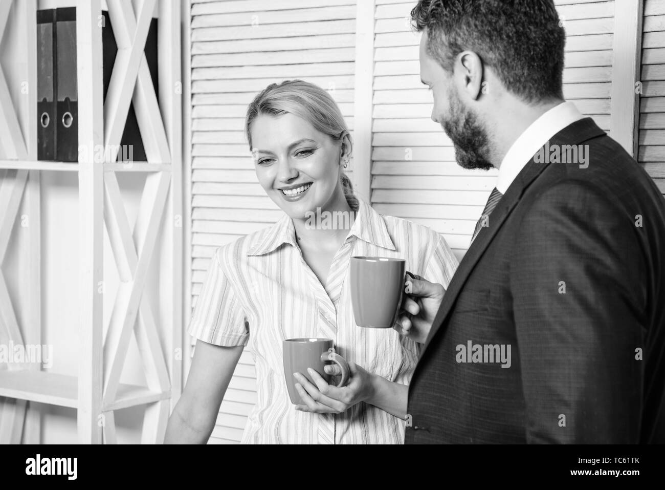 Corporate man woman having coffee Black and White Stock Photos & Images ...
