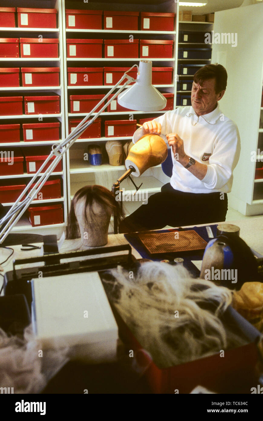 WIG MAKER workshop with wigs in different stages Stock Photo - Alamy